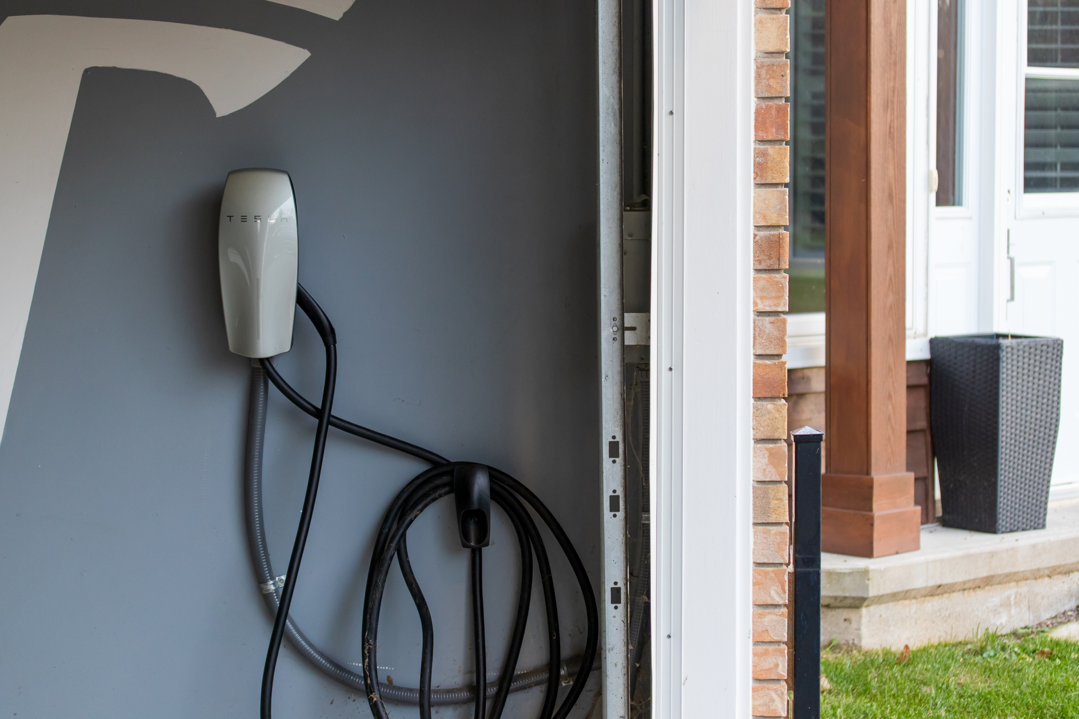 Tesla Wall Connector vs Universal Chargers | EV Power Solutions
